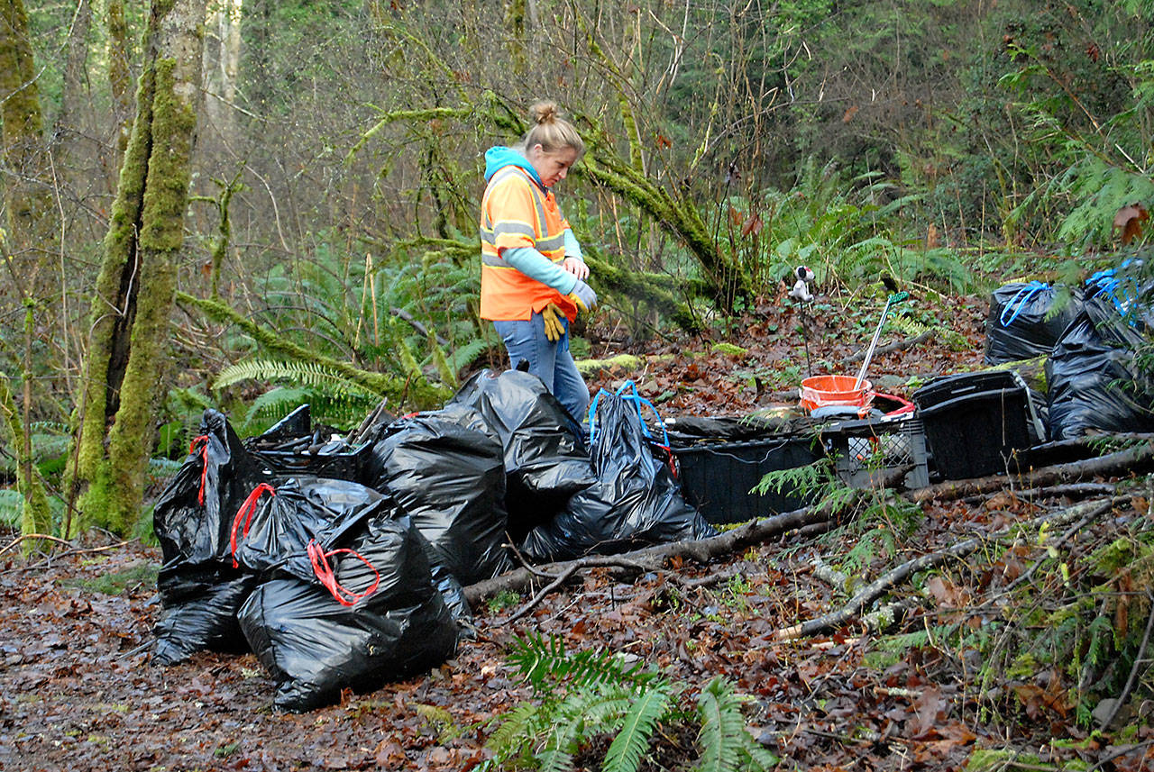 PHOTOS: Volunteers clean up homeless encampment in Port Angeles ...