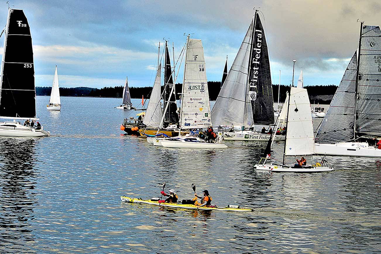 Racers paddle, harness wind to sail Puget Sound | Peninsula Daily News