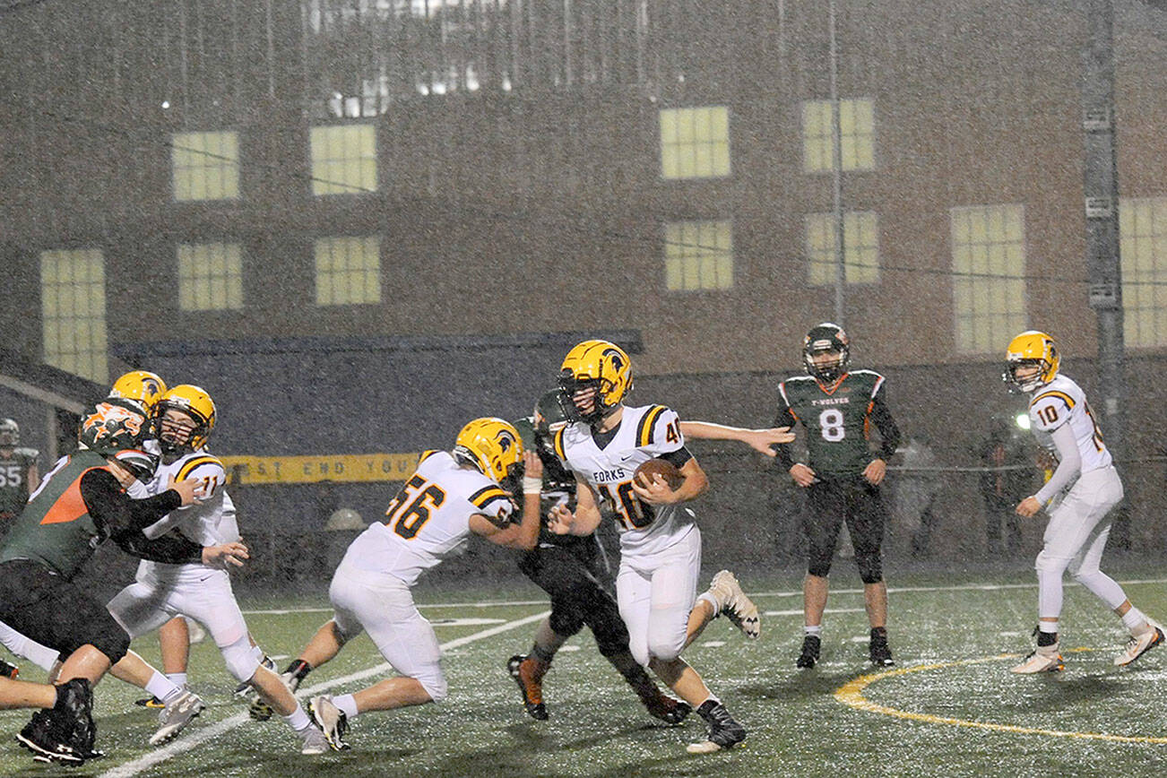PREP FOOTBALL: Forks runs wild in monsoon | Peninsula Daily News